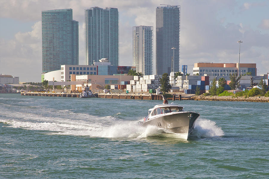 Fast-moving Pleasure Boat On City Waters by Barry Winiker