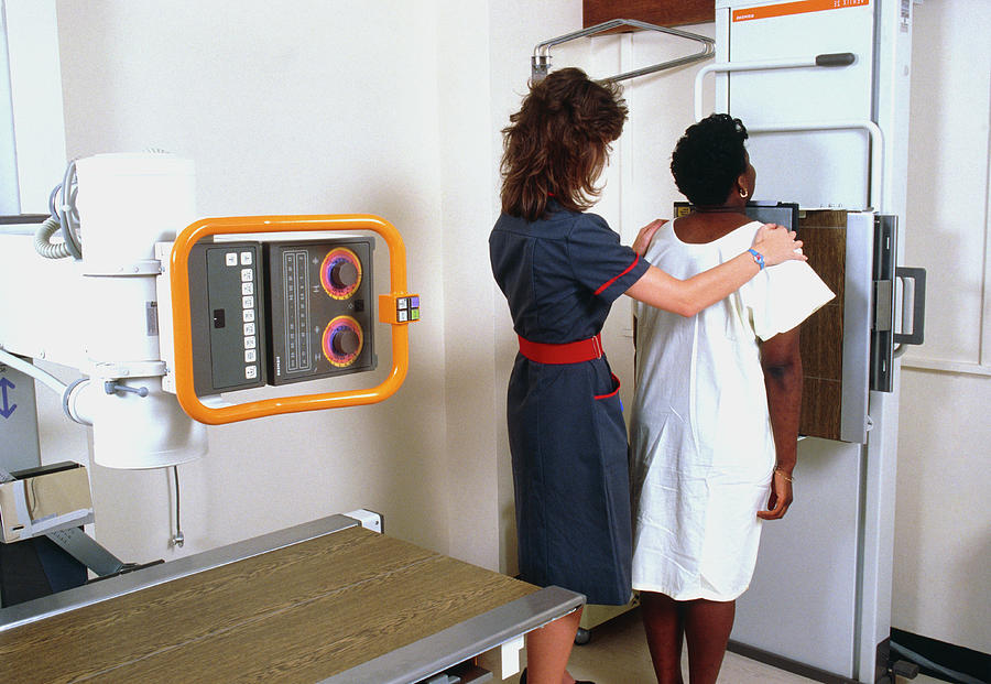 Woman About To Undergo Chest X-ray by Chris Priest / Science Photo Library
