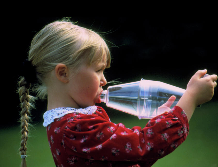 Young Girl With Asthma Uses An Inhaler Adaptor by Garry Watson ...