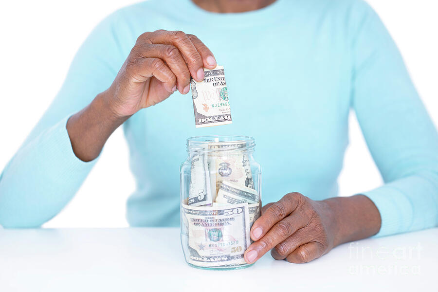 Woman Saving Money #3 by Science Photo Library