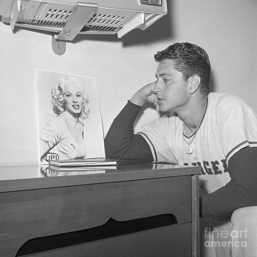 Bo Belinsky Admiring Portrait Of Mamie by Bettmann