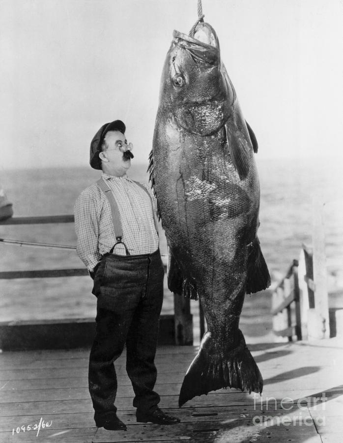 Chester Conklin Stands By Giant Fish by Bettmann