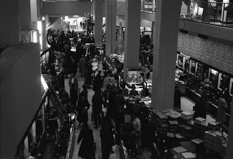 Crowds In Department Store by George Marks