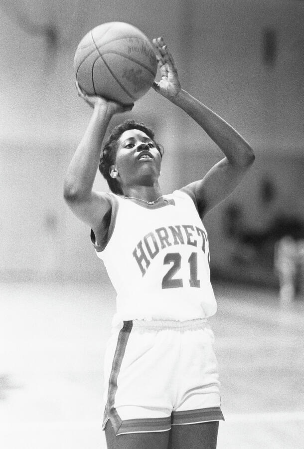 Female Basketball Player Throwing Ball by Delaware State University