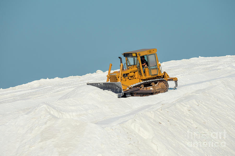 Levelling A Sea Salt Mound by David Parker / Science Photo Library