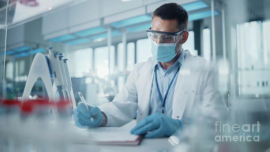 Scientist Wearing A Face Mask by Gorodenkoff Productions / Science ...