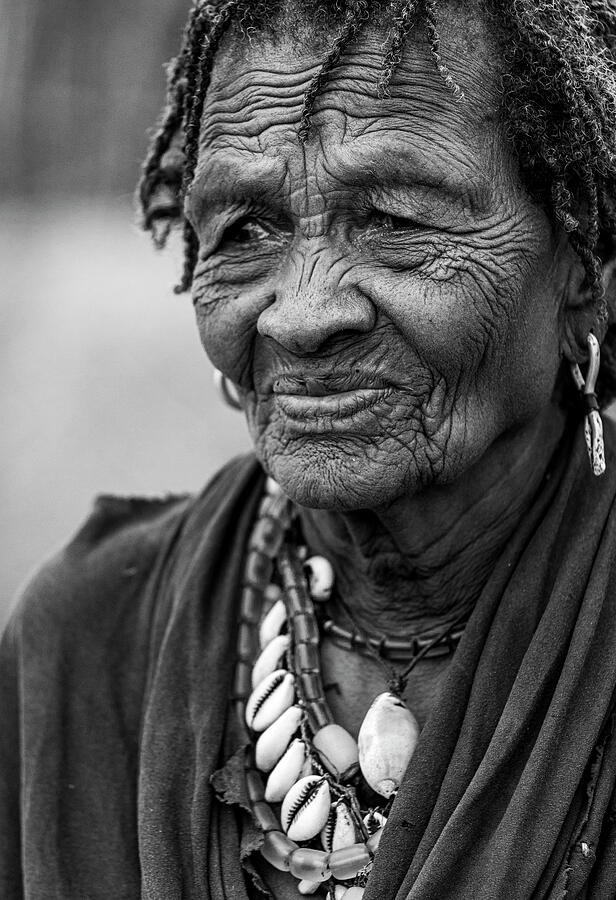 An old Abore tribeswoman from the Omo Valley of Ethiopia. Photograph by ...