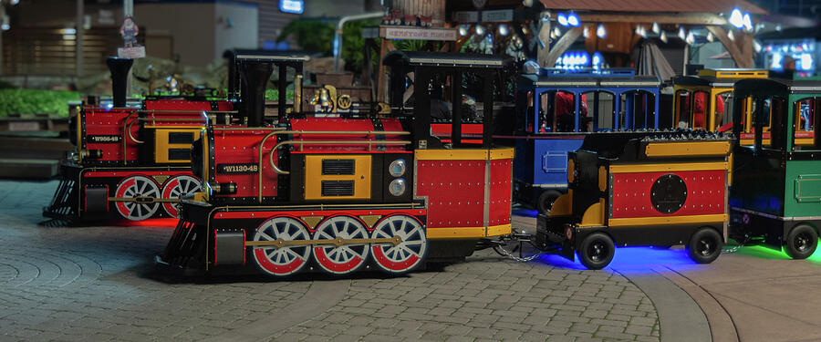 Miniature Train Display at Night Photograph by Atiba Kojo - Metal Posters